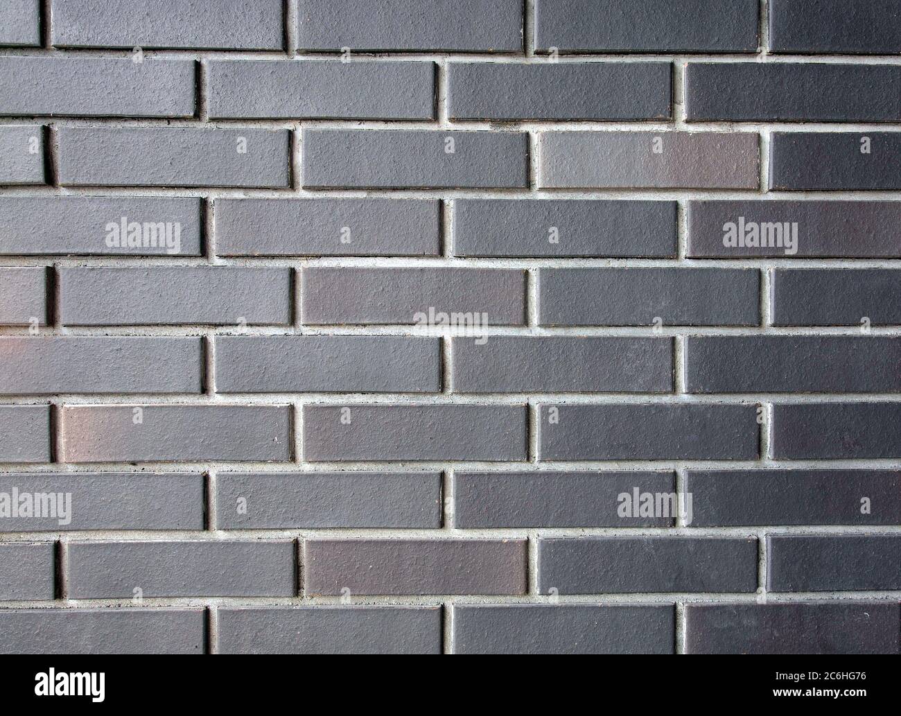 Stylish modern new graphite brick wall Stock Photo - Alamy
