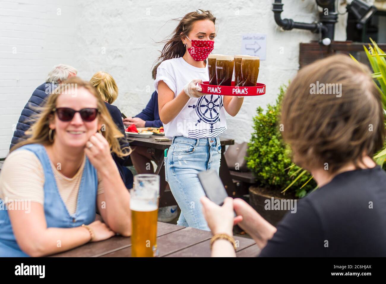 The public enjoy their first drinks from a pub at Teuchters Landing ...