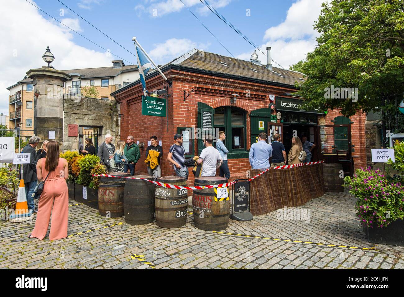 The public enjoy their first drinks from a pub at Teuchters Landing ...
