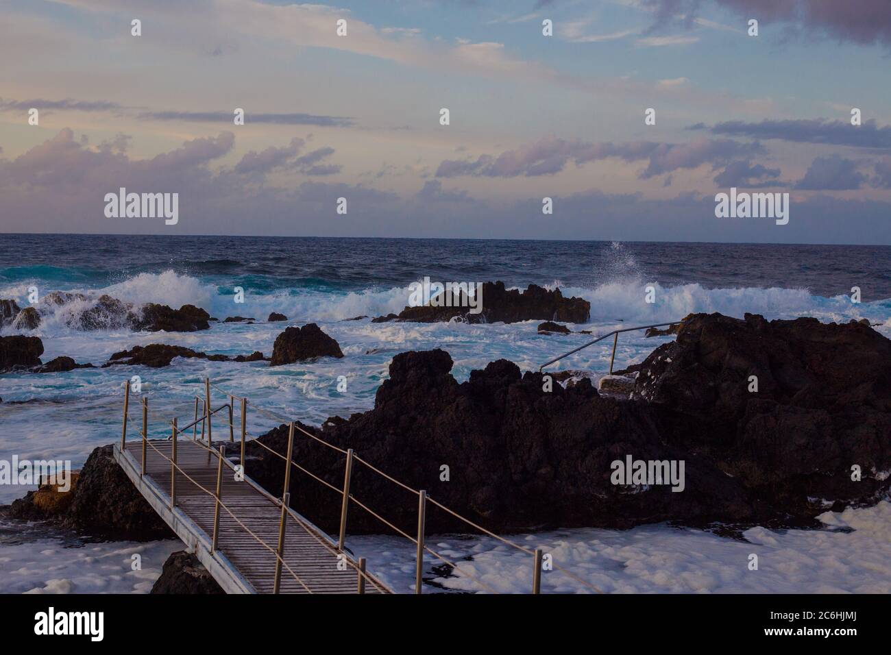 Lava stones on the beach of Piscinas Naturais Biscoitos. Atlantic Ocean ...