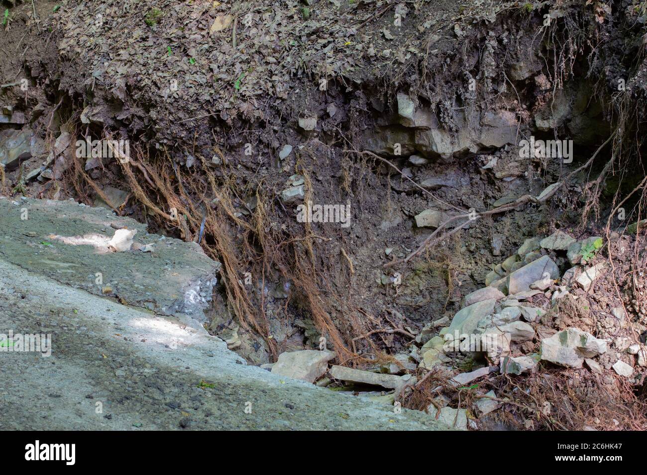 Road damage and destroyed blank roots after a flood Stock Photo - Alamy