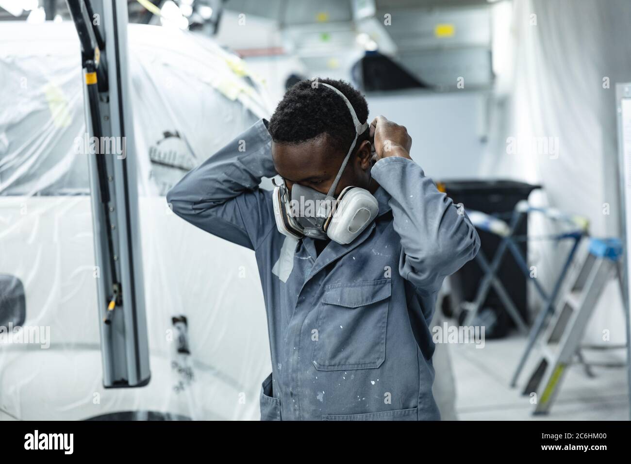 African American man car painter setting mask Stock Photo - Alamy