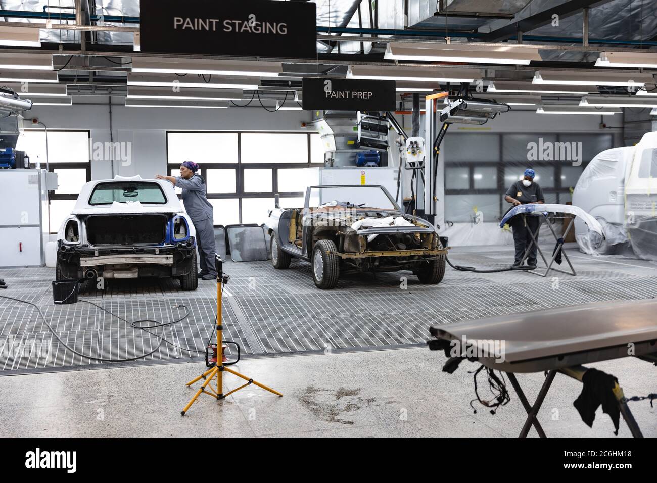 African American mechanics sanding and checking cars Stock Photo - Alamy