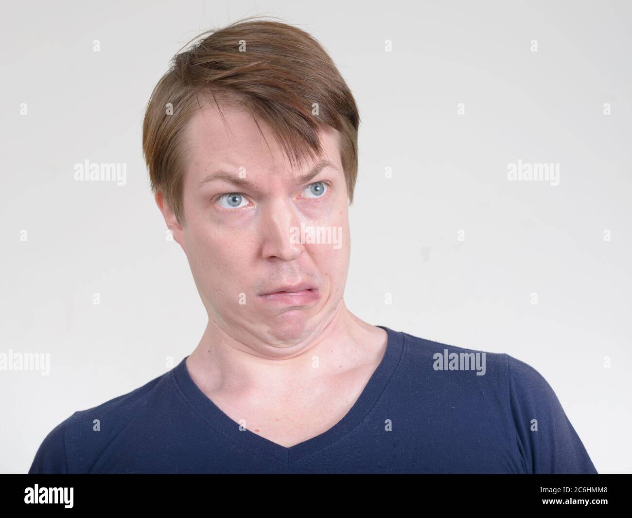Face of stressed young man looking scared Stock Photo - Alamy