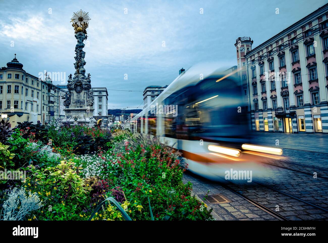 Trinity Column with flowerbed and tramway in Linz, Austria Stock Photo ...