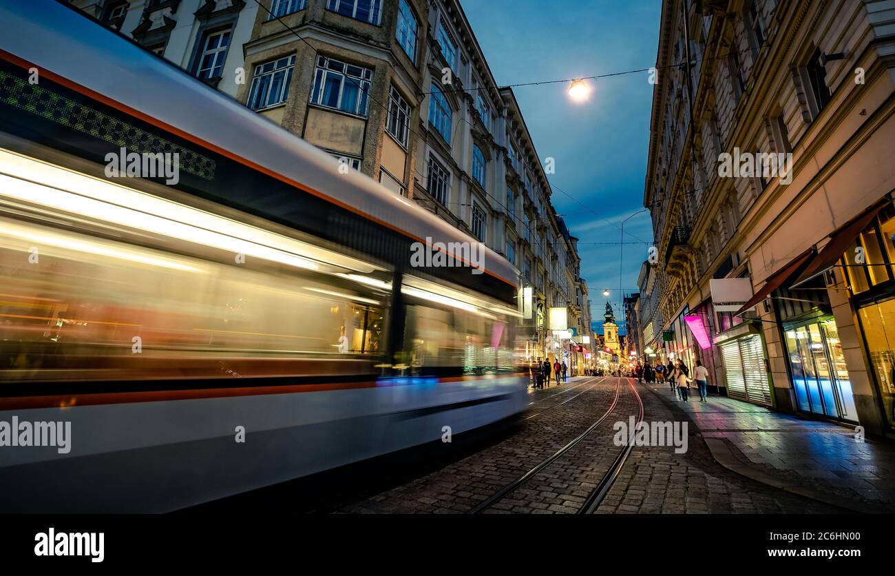 Evening tramway riding on central streets of Linz, Austria Stock Photo ...
