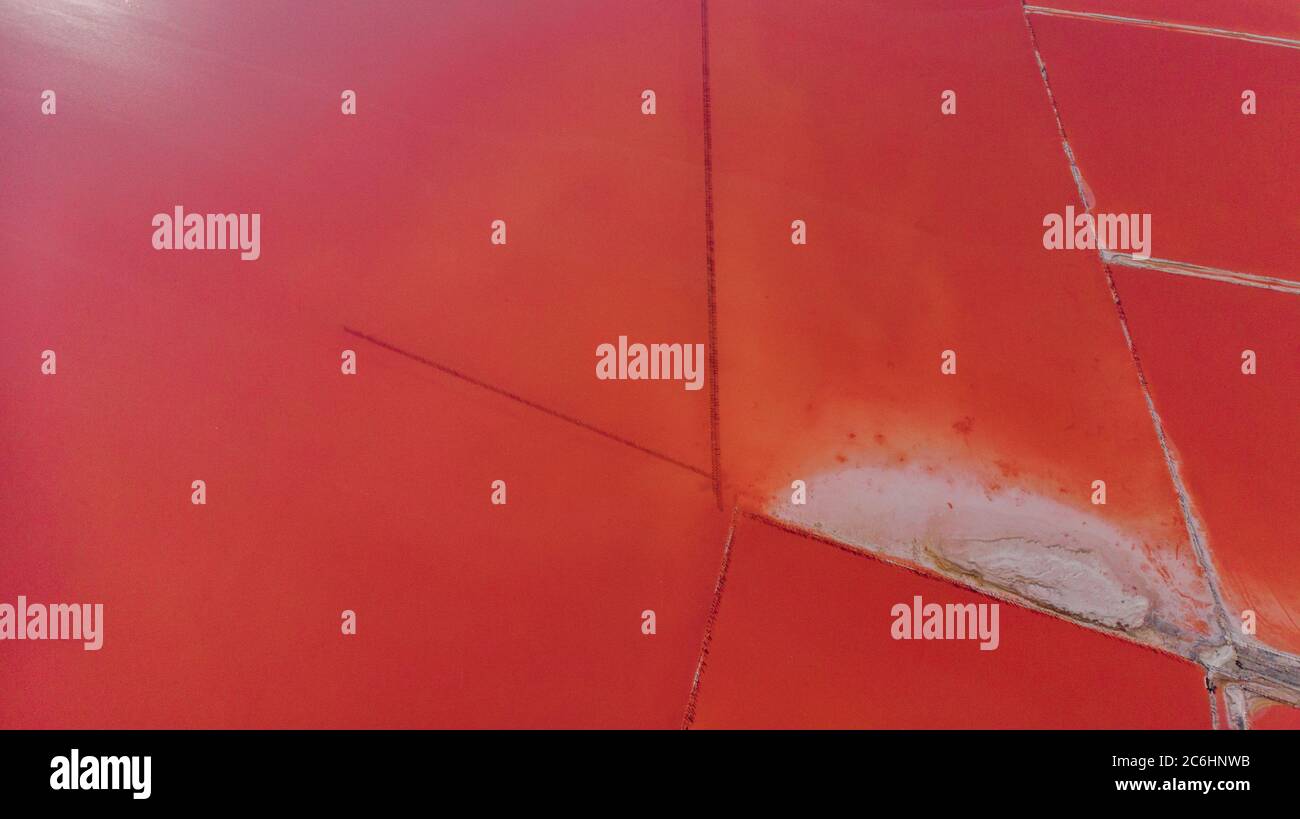 View from drone above the pink salty Genichesk lake and sand spit in ...