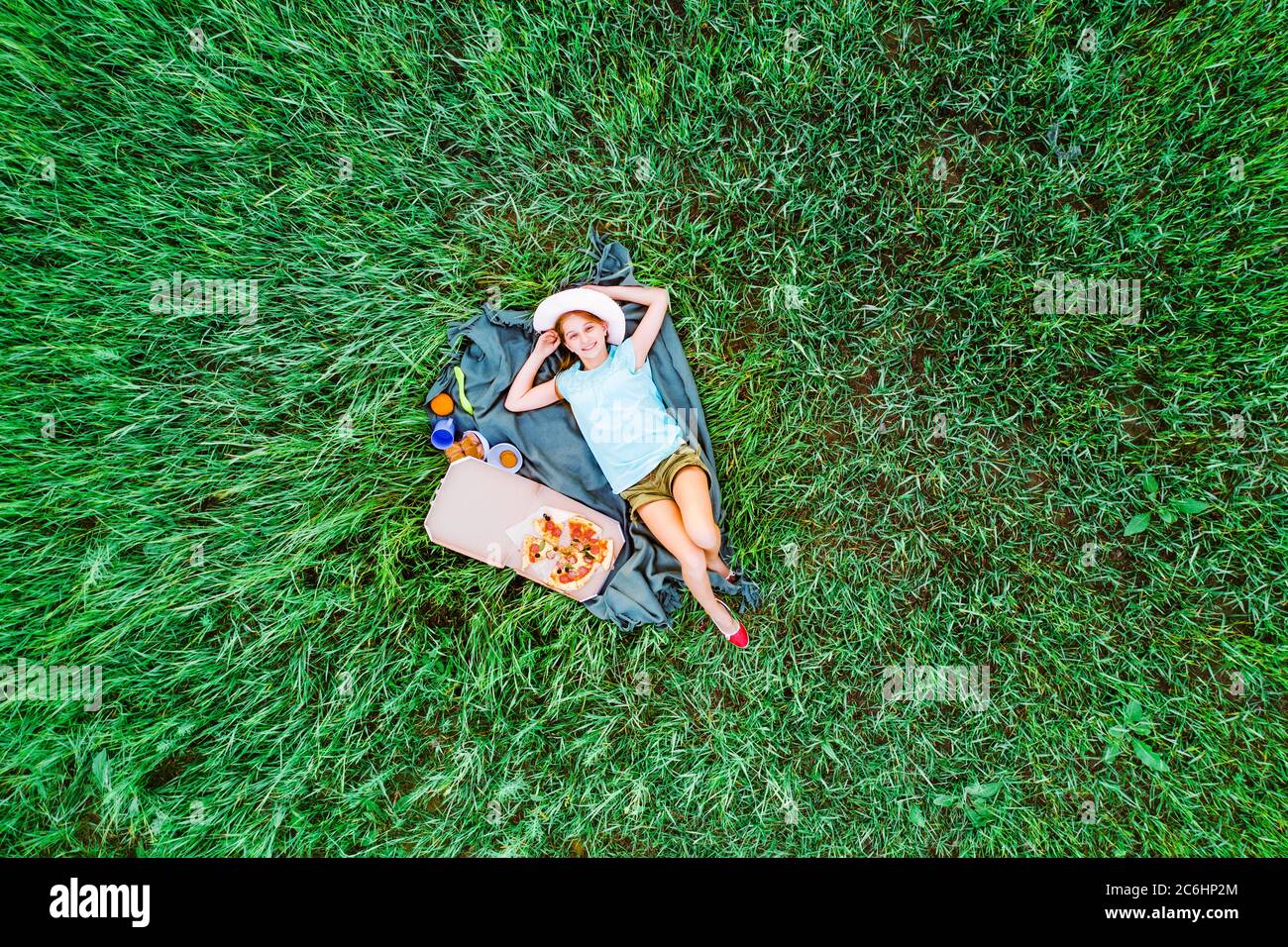little girl on a green grass, aerial top view Stock Photo - Alamy