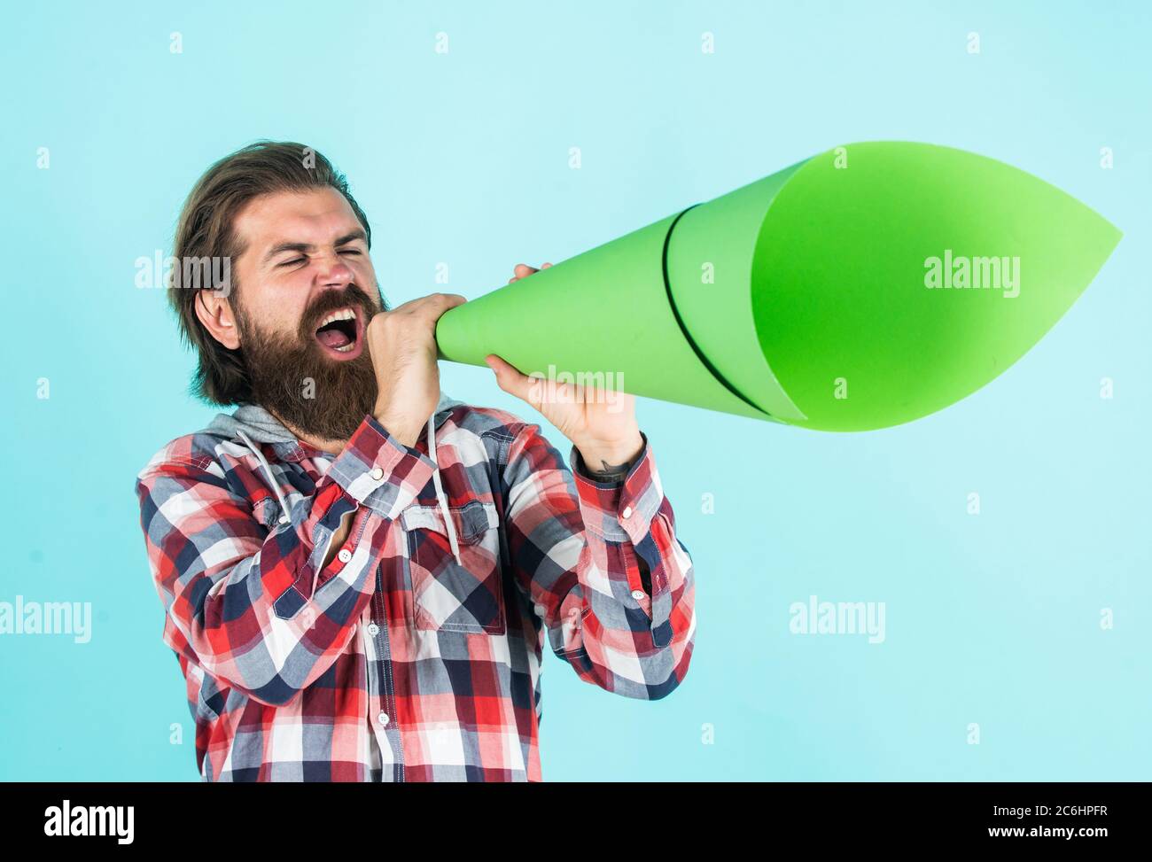 make voice louder. bearded man shout in megaphone. man with paper ...