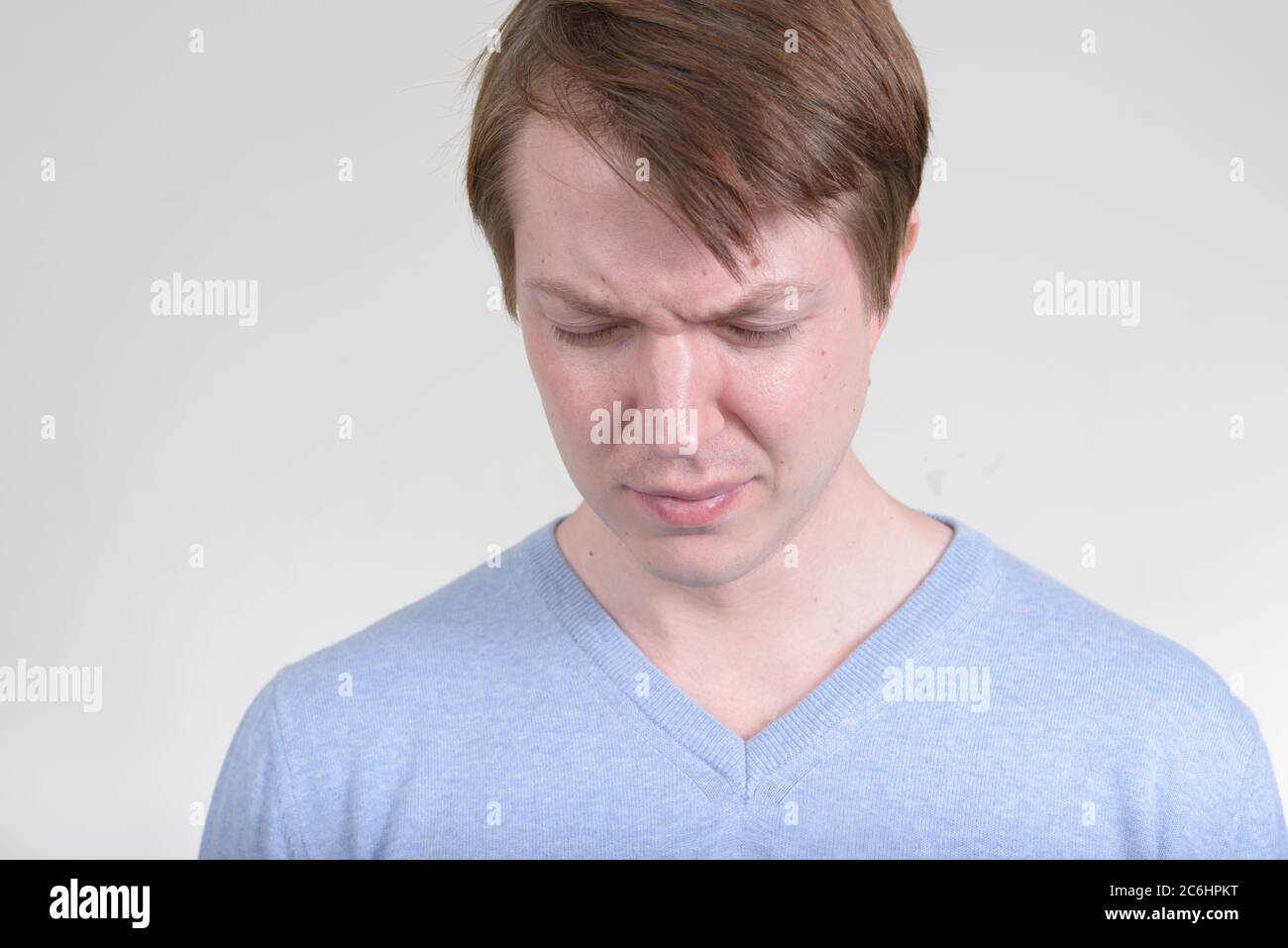 Portrait of stressed young man looking sad and depressed Stock Photo ...