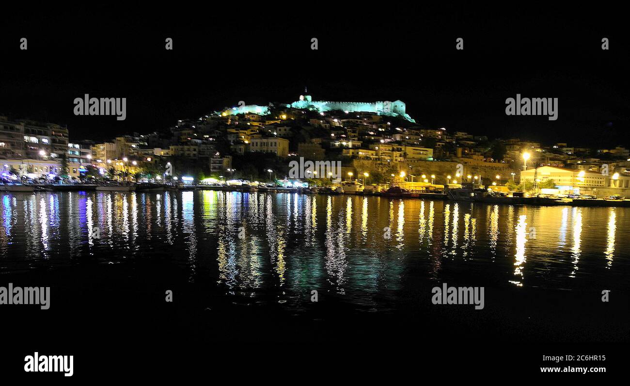 Greece, illuminated city of Kavala with harbor Stock Photo - Alamy