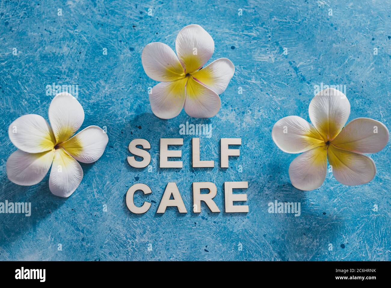 relaxation and self-worth concept, Self care text with blue background ...