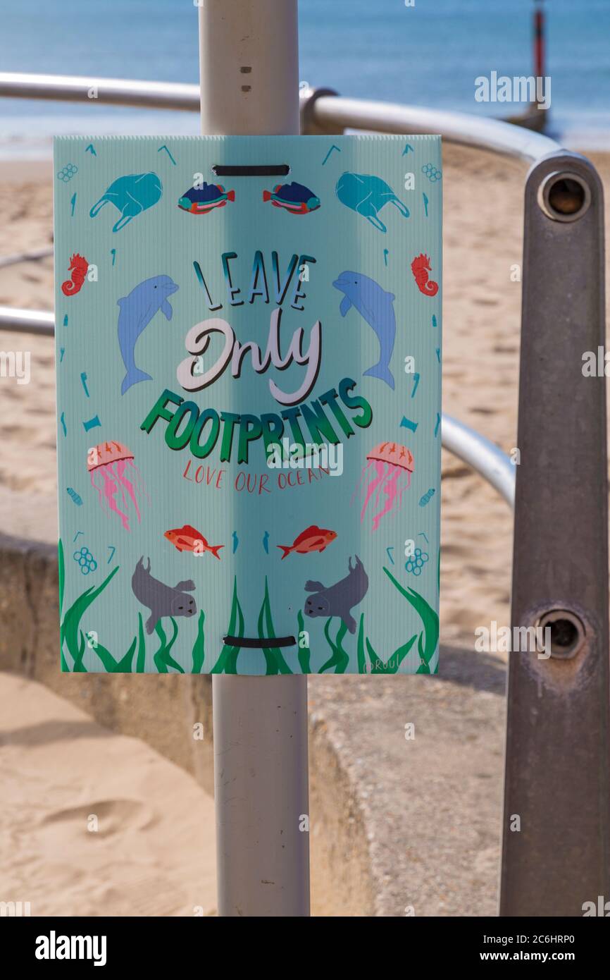 Leave only footprints love our ocean poster hi-res stock photography ...