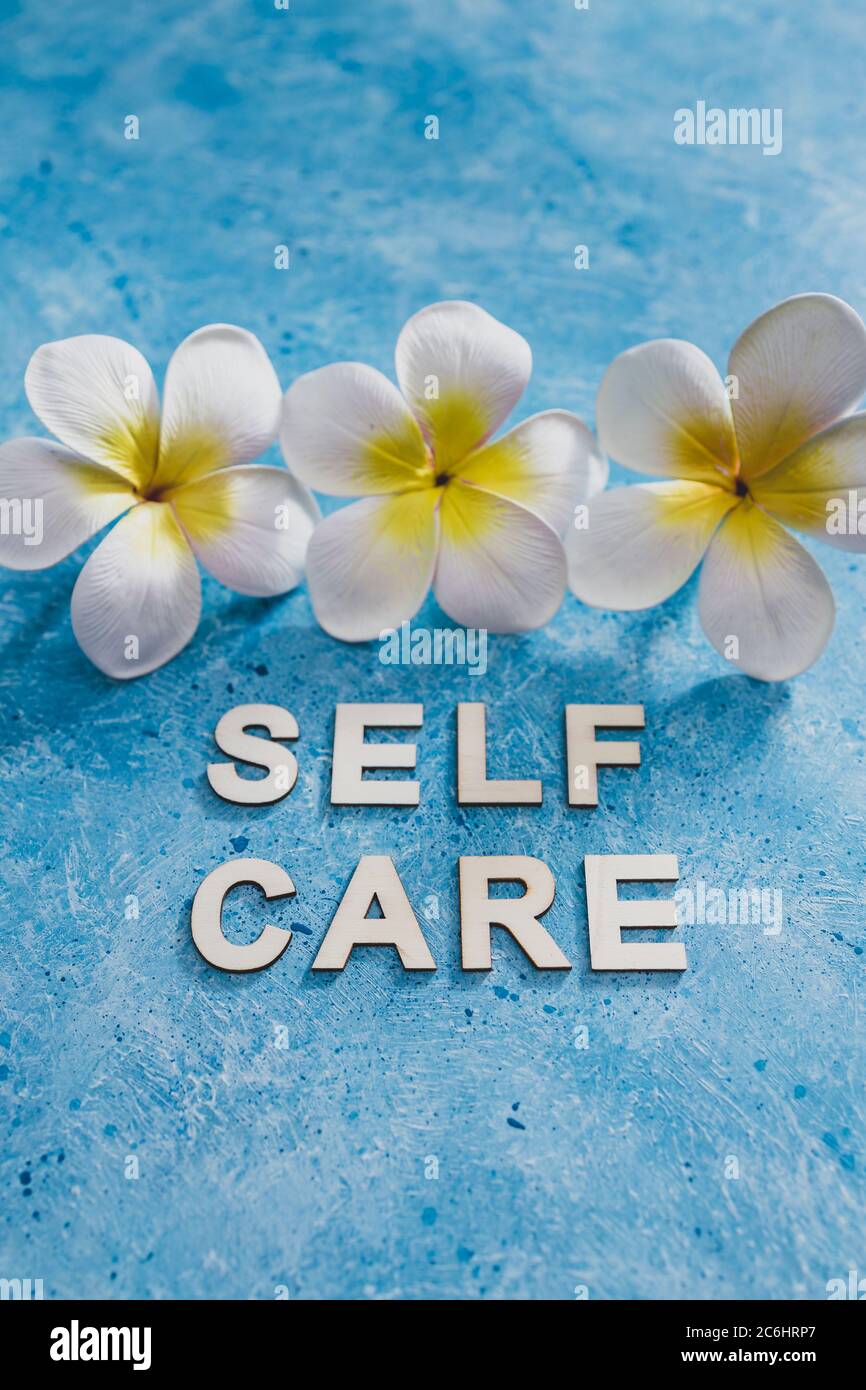 relaxation and self-worth concept, Self care text with blue background ...