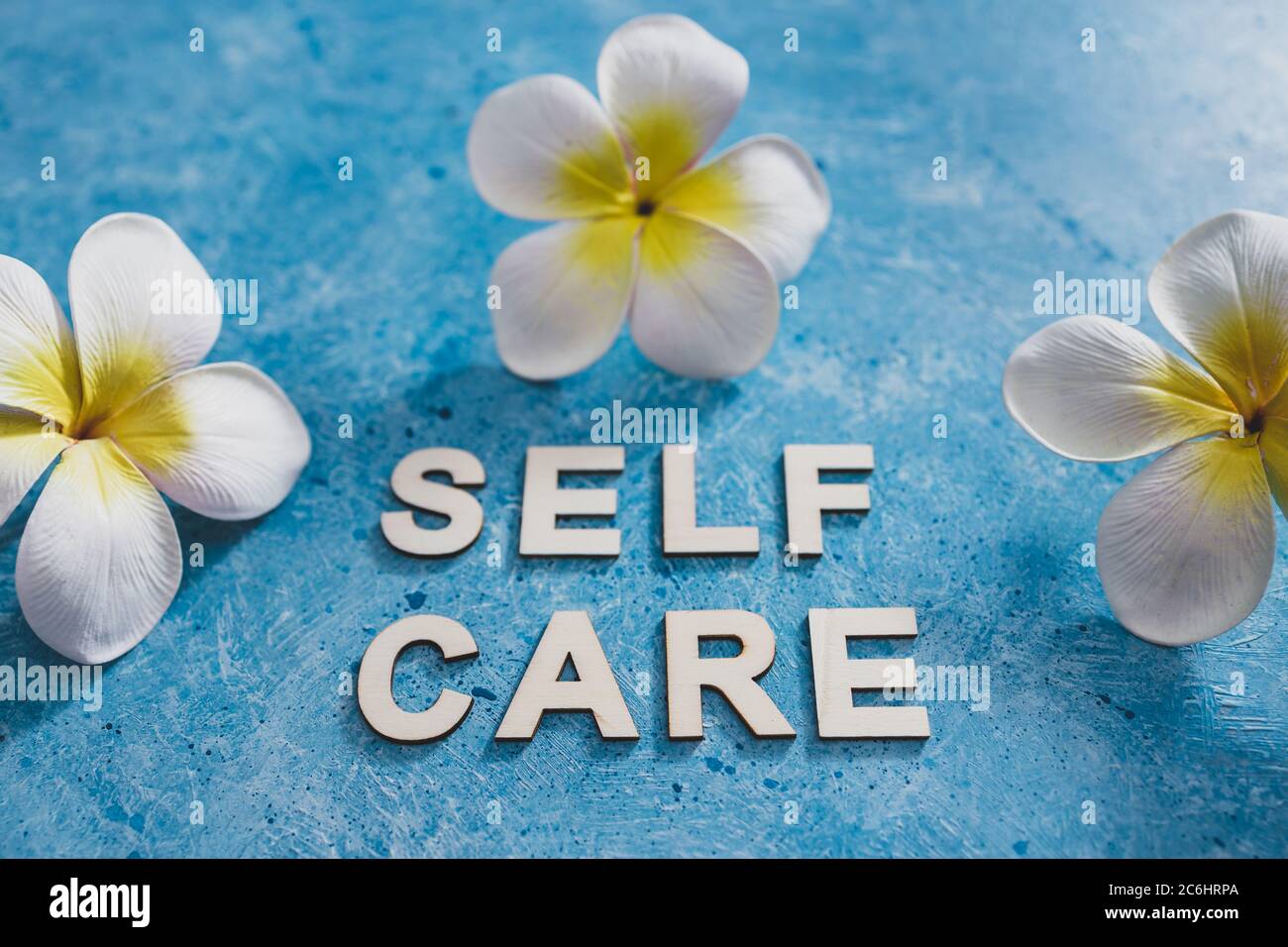 relaxation and self-worth concept, Self care text with blue background ...