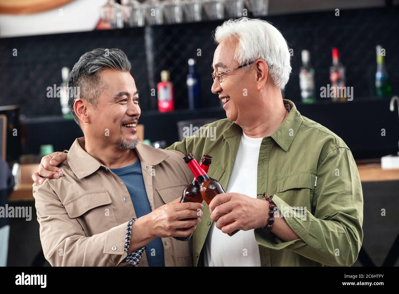 Happy old brothers to drink a toast to celebrate the occasion Stock ...