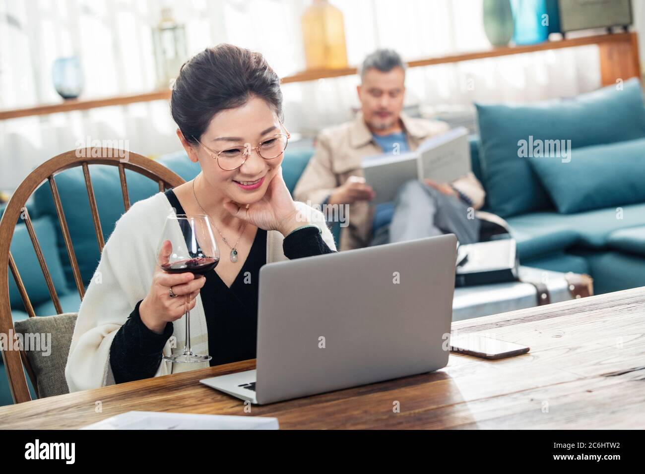 Elegant in old people to use a computer at home Stock Photo - Alamy