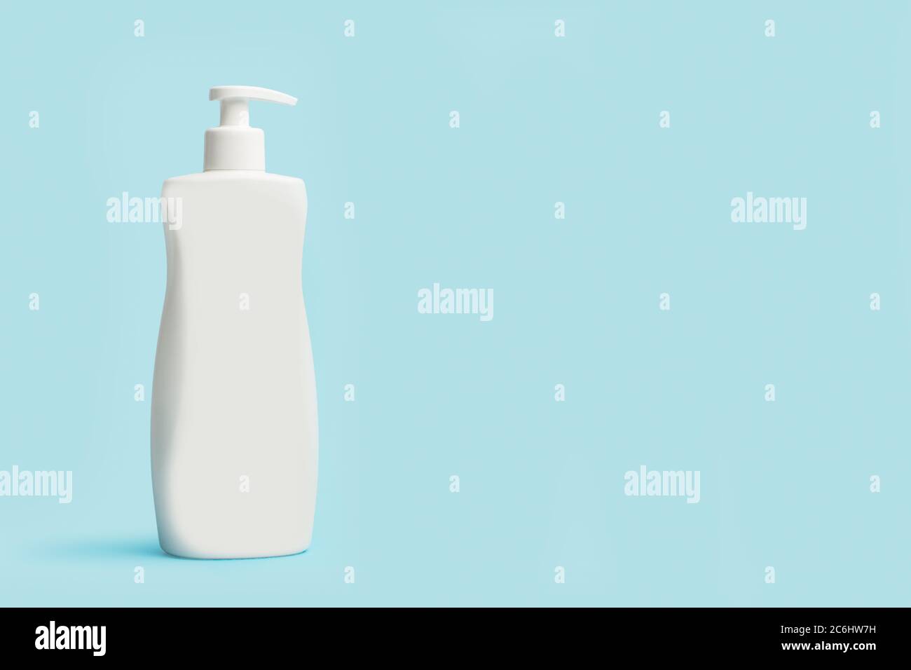 A body cream bottle on a light blue background with copy space Stock ...