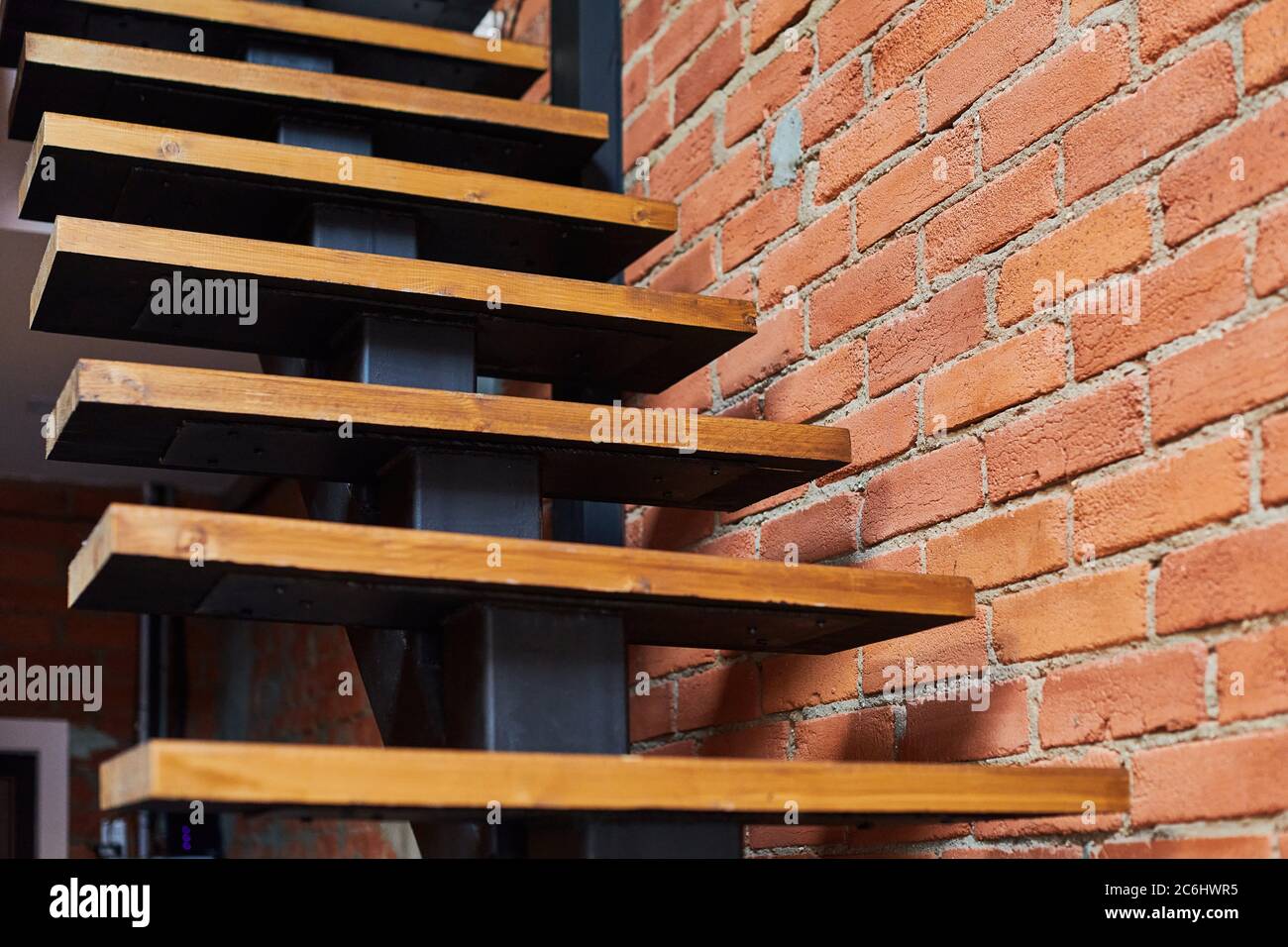 Stairs in loft apartment. Staircase without railing. Modern hipster ...