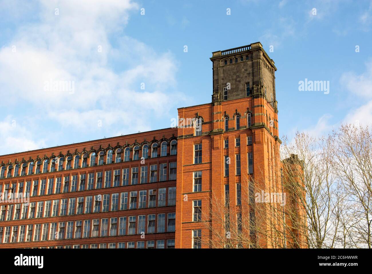 Tall old Derbyshire mill building Stock Photo - Alamy