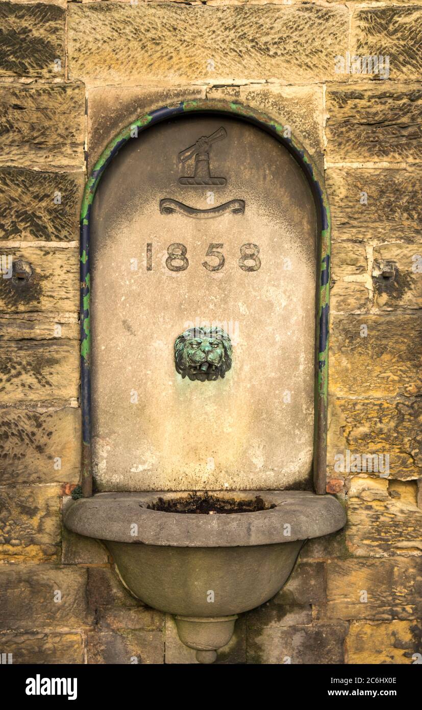 Ancient stone drinking water fountain Stock Photo - Alamy