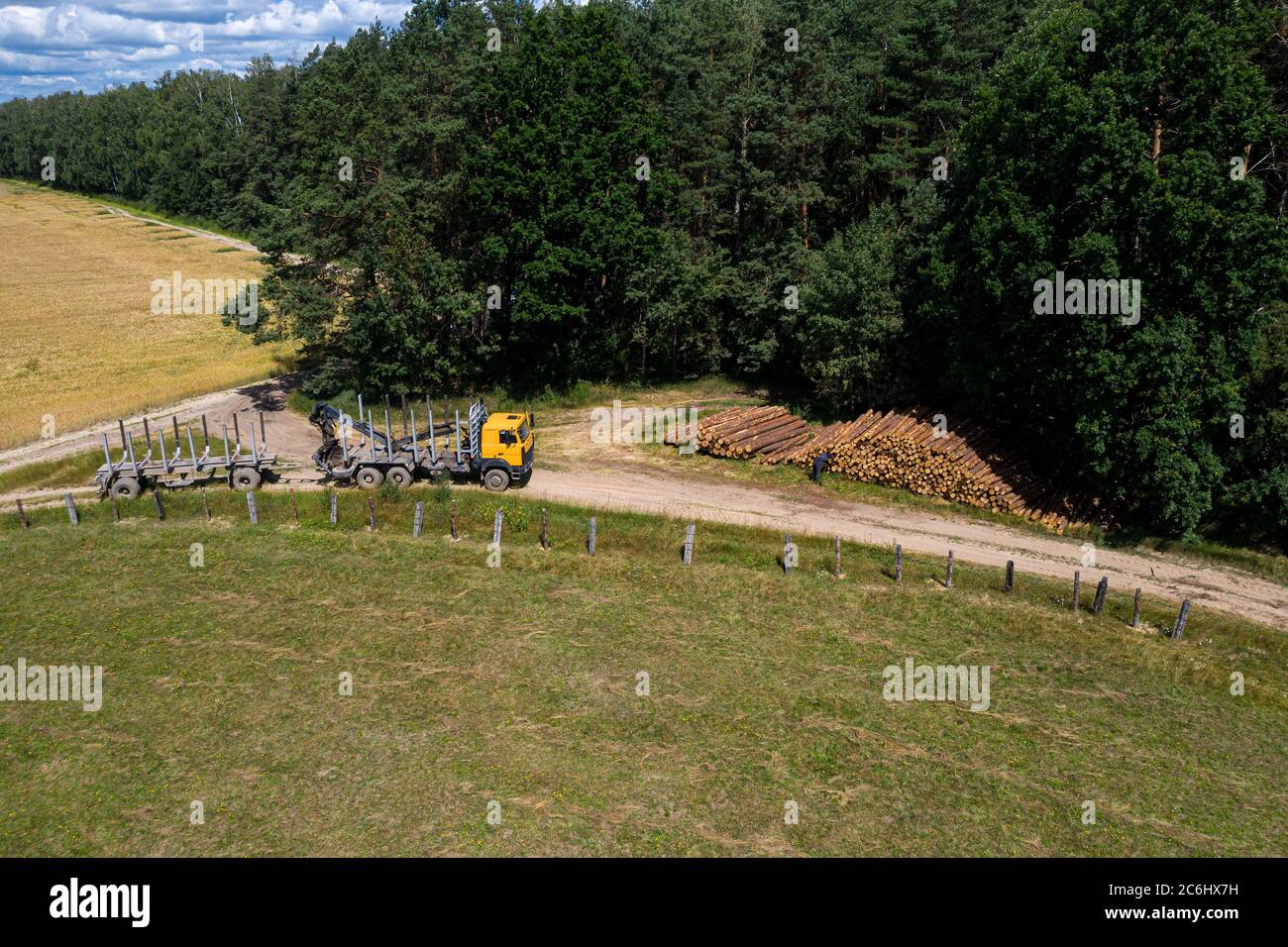 The logging truck is preparing for loading. Logging the view from the ...