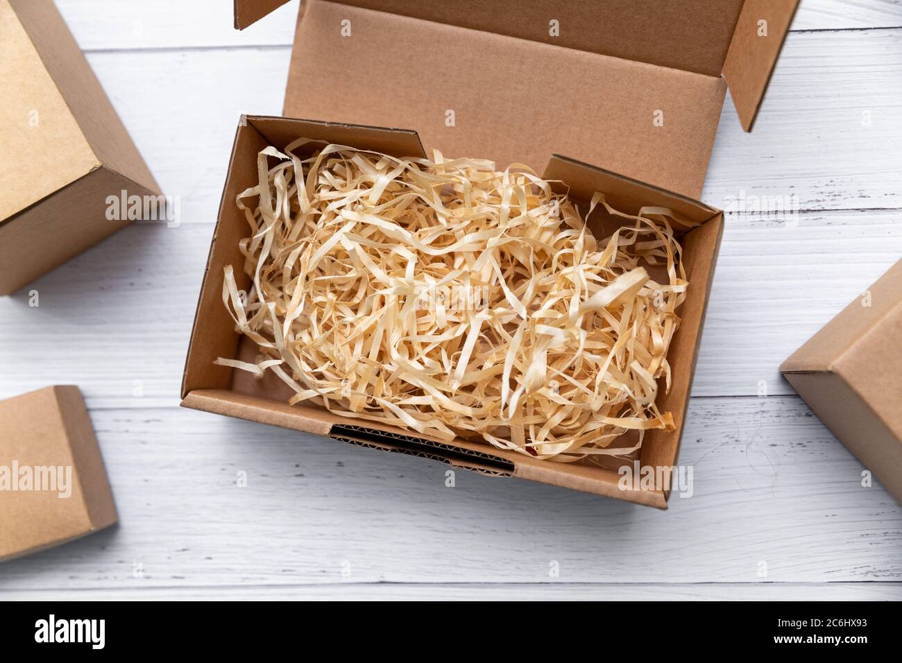 packaging design - cardboard box with wood shavings. top view Stock ...