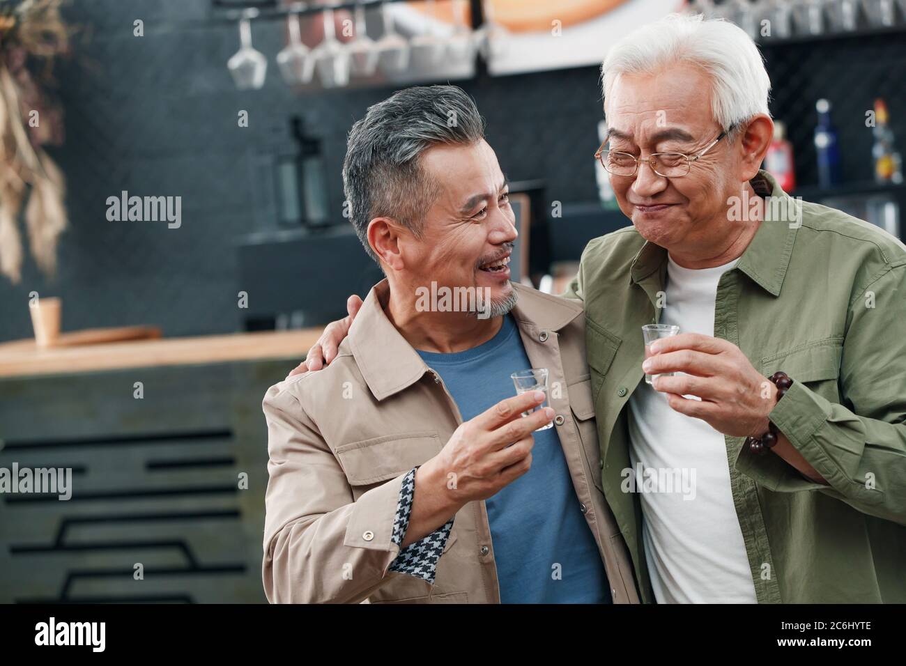 Happy old brothers to drink chat Stock Photo - Alamy