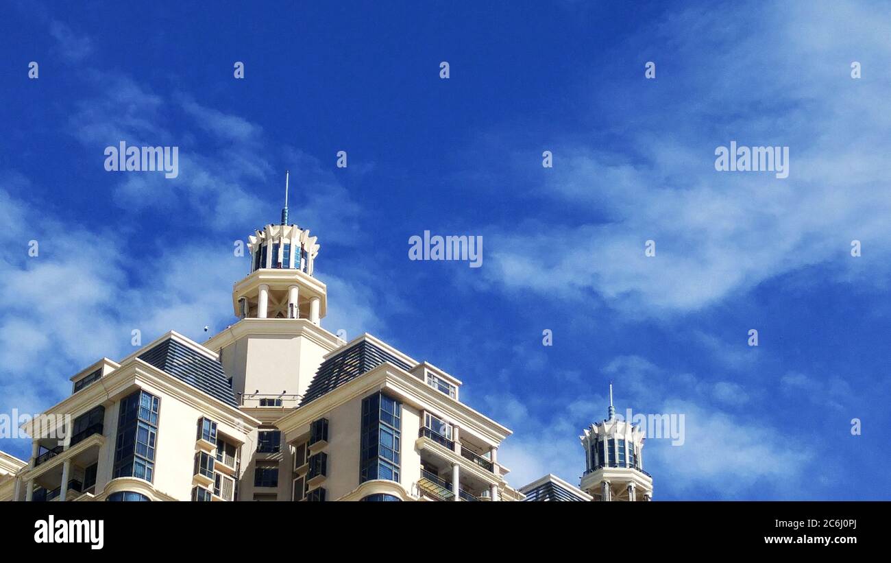 Shenzhen, China: residential buildings under blue sky and white clouds ...