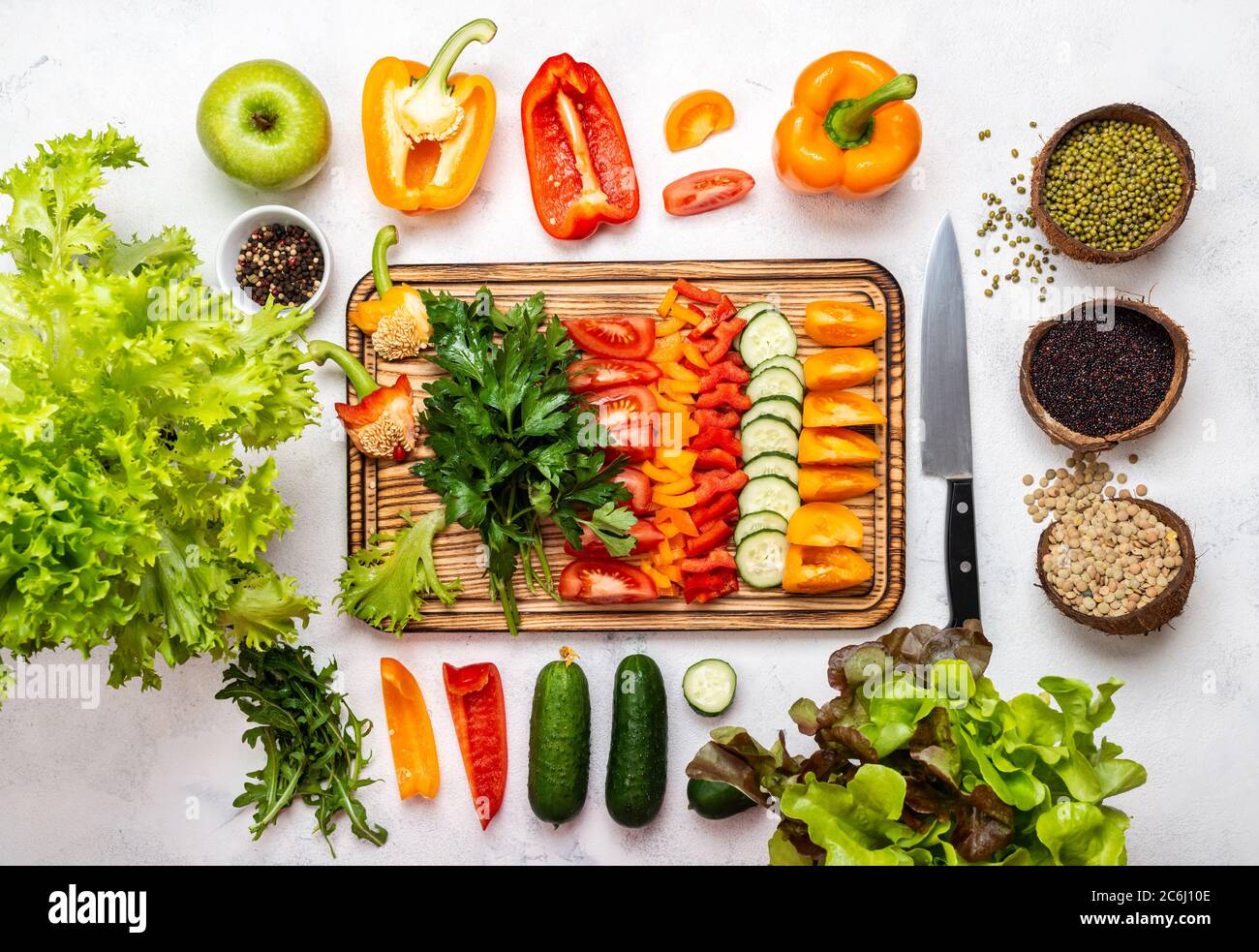 Chopped different vegetables on cutting board and cereals Stock Photo ...