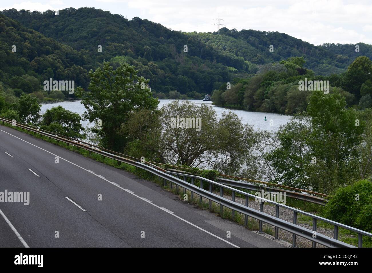 waterfront road in the Mosel valley with a view to Winningen Stock ...