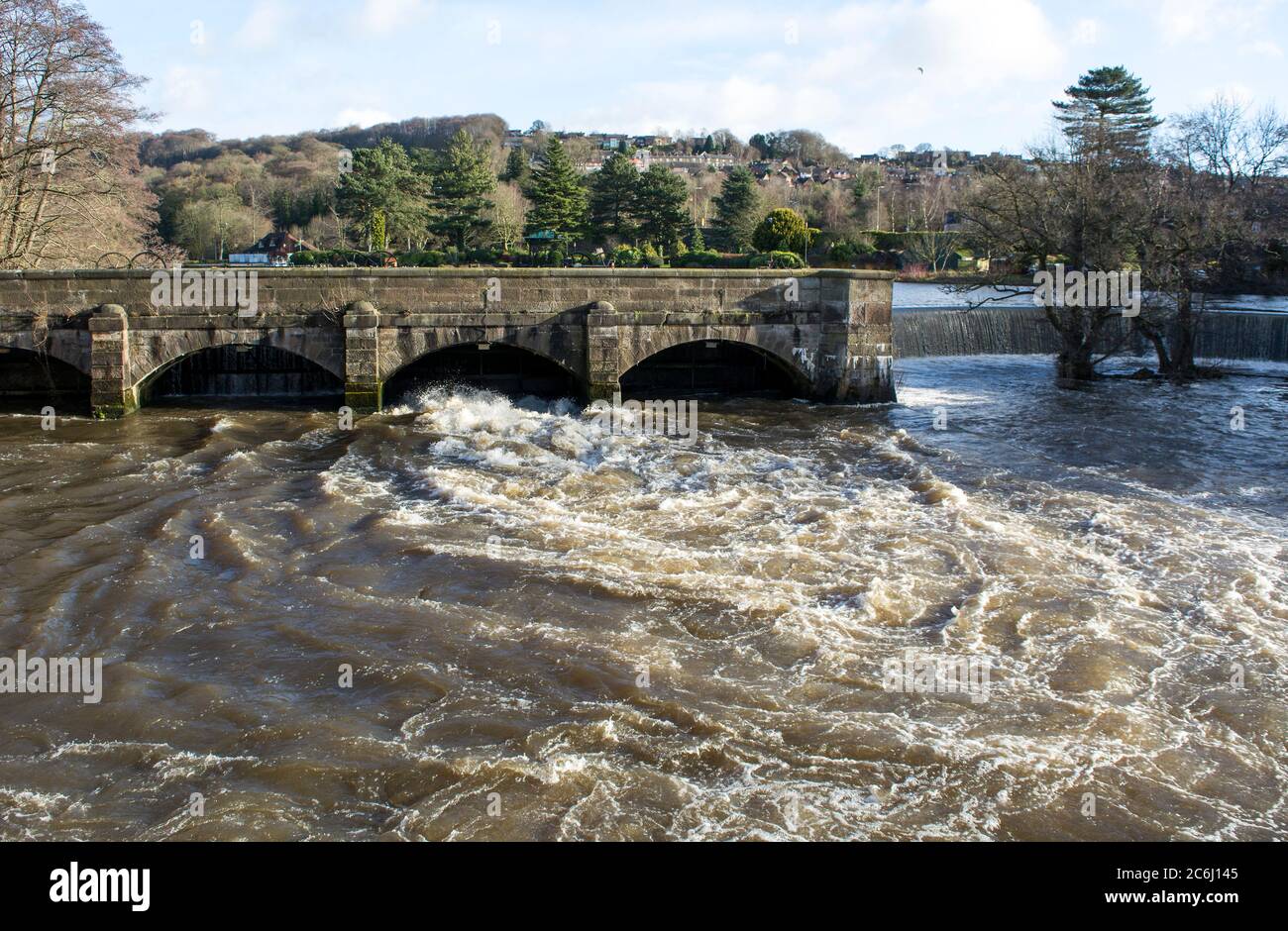 Old stone arched river weir bridge Stock Photo - Alamy
