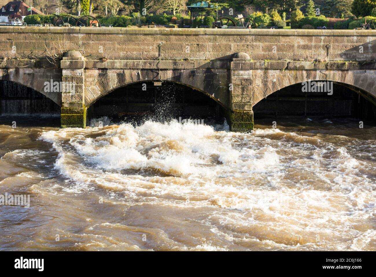 Old stone arched river weir bridge Stock Photo - Alamy