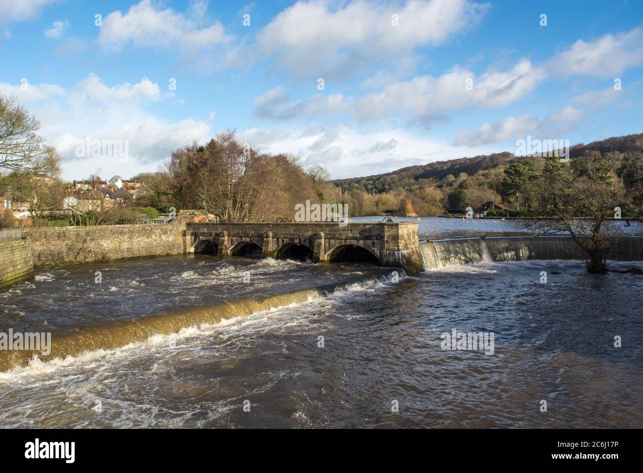 Old stone arched river weir bridge Stock Photo - Alamy