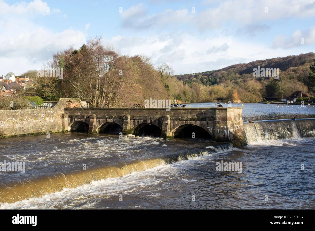 Old stone arched river weir bridge Stock Photo - Alamy