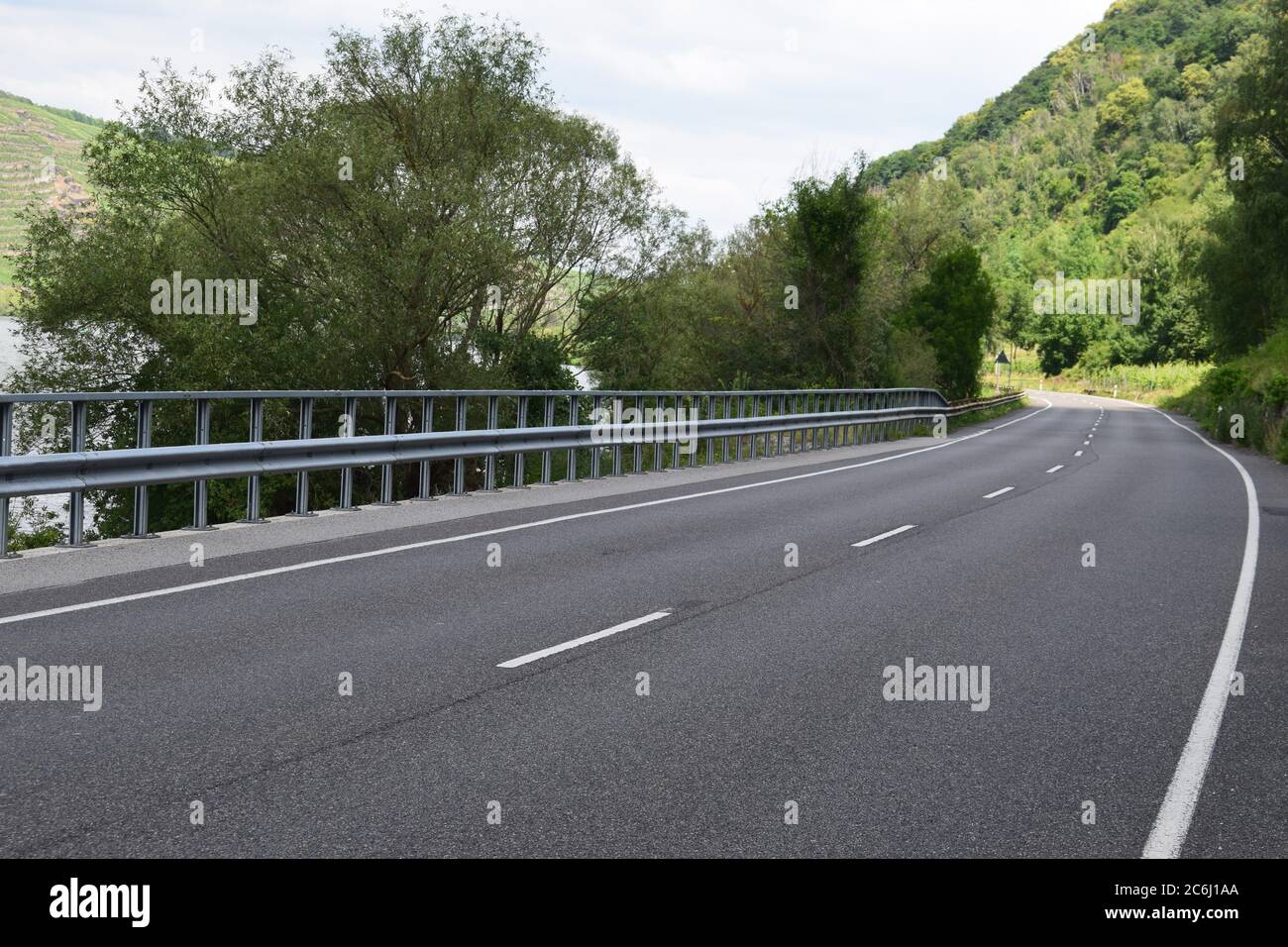 waterfront road in the Mosel valley with a view to Winningen Stock ...