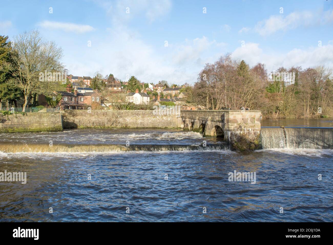 Old stone arched river weir bridge Stock Photo - Alamy