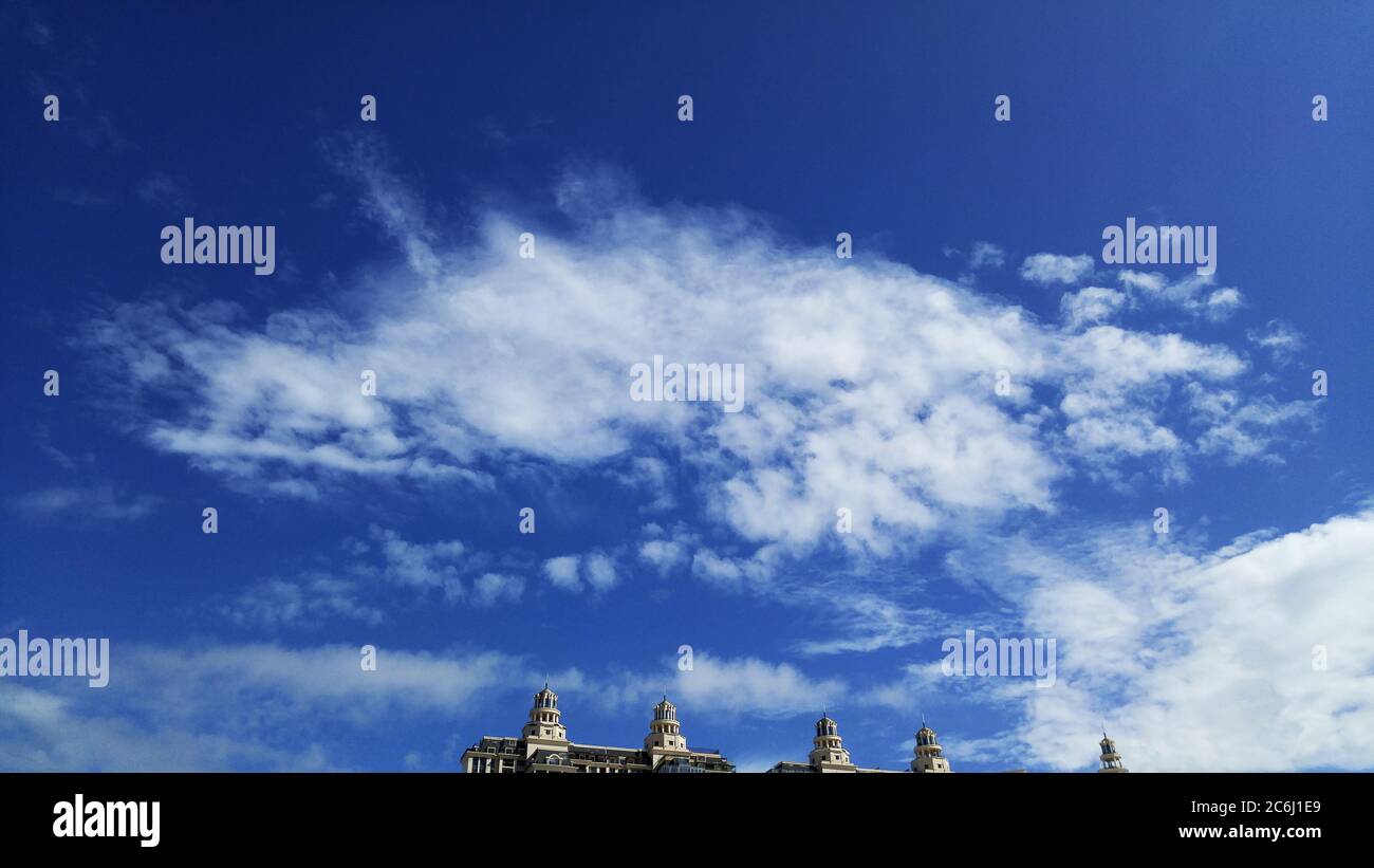 Shenzhen, China: residential buildings under blue sky and white clouds ...