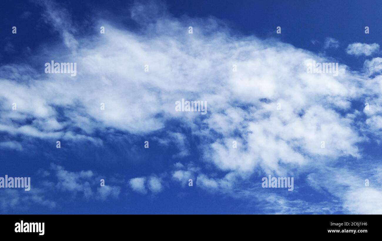Shenzhen, China: residential buildings under blue sky and white clouds ...