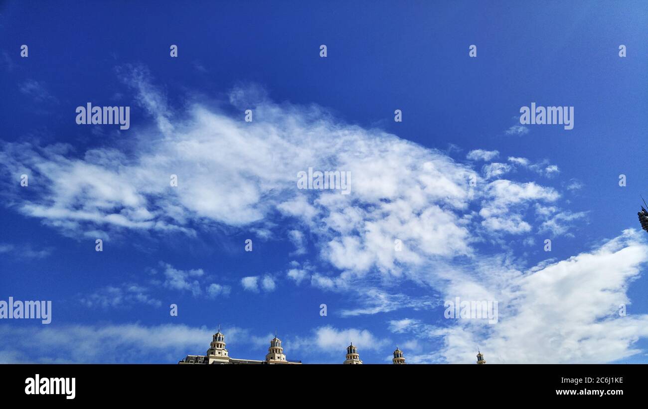 Shenzhen, China: residential buildings under blue sky and white clouds ...