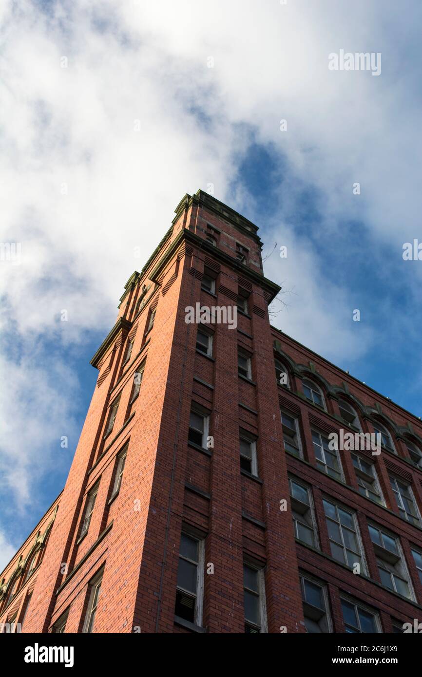 Tall old Derbyshire mill building Stock Photo - Alamy