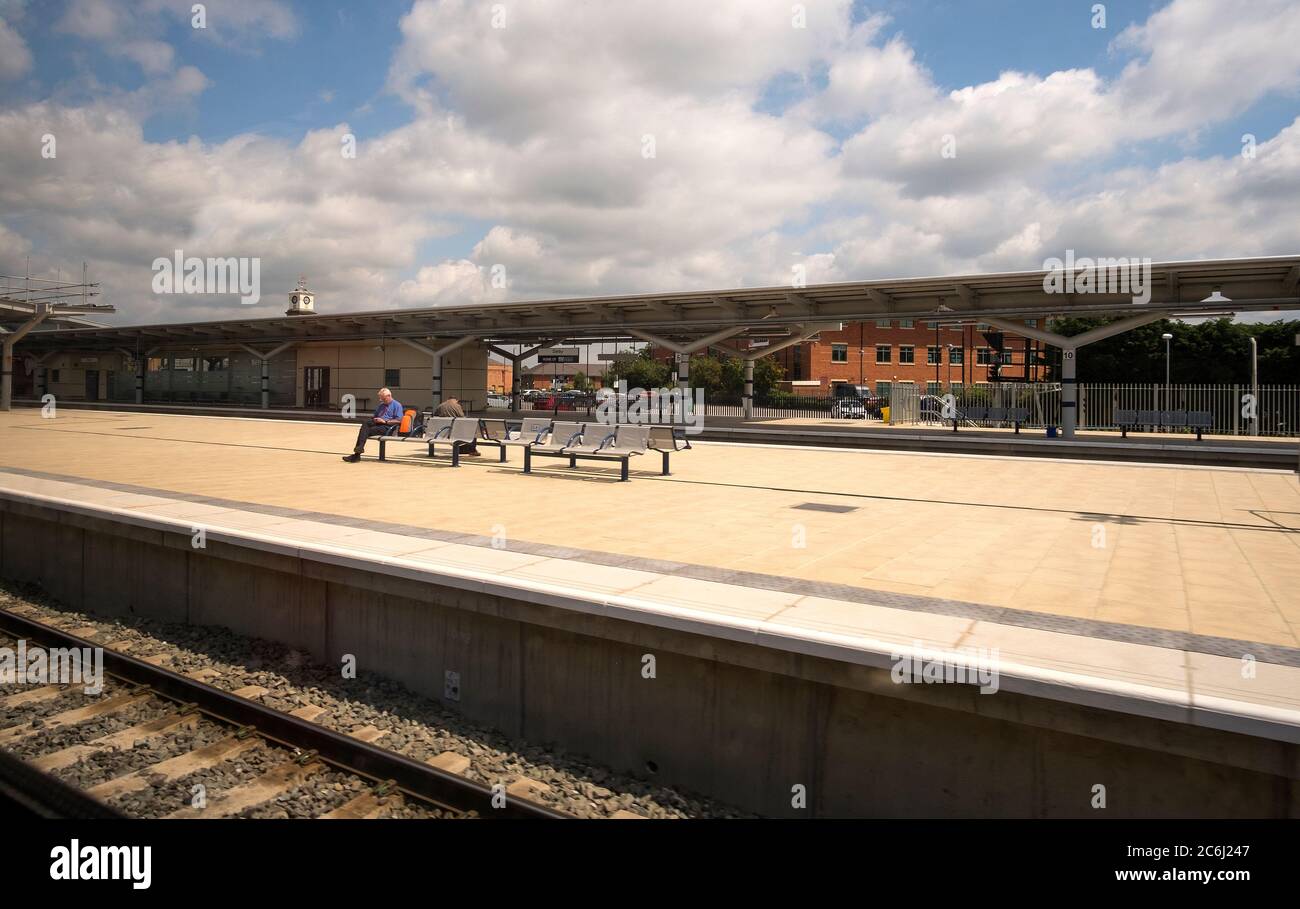 Seats on a railway platform Stock Photo - Alamy