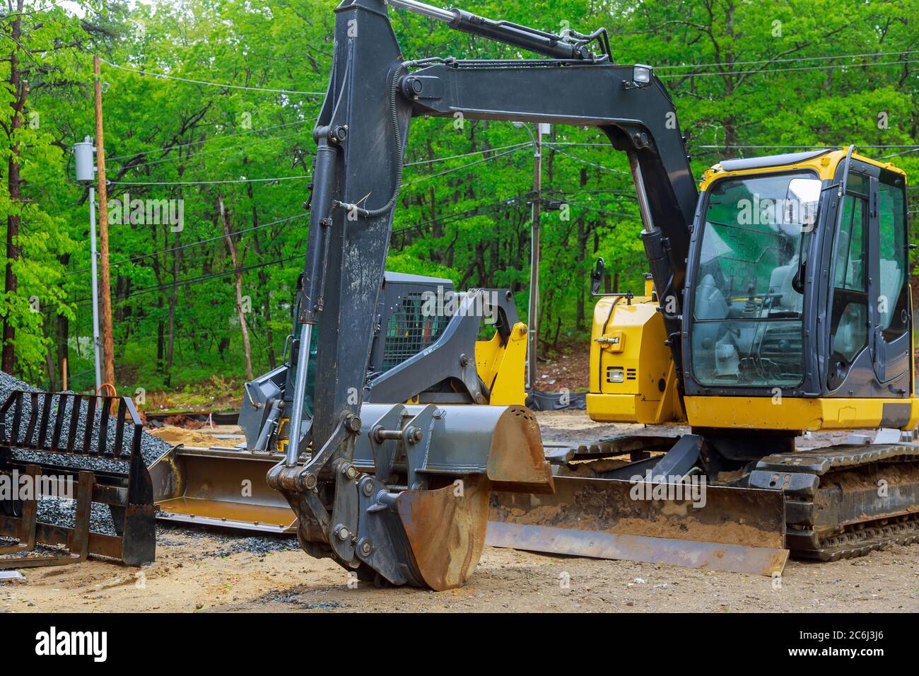 Group of excavator working on a construction site mini excavator ...