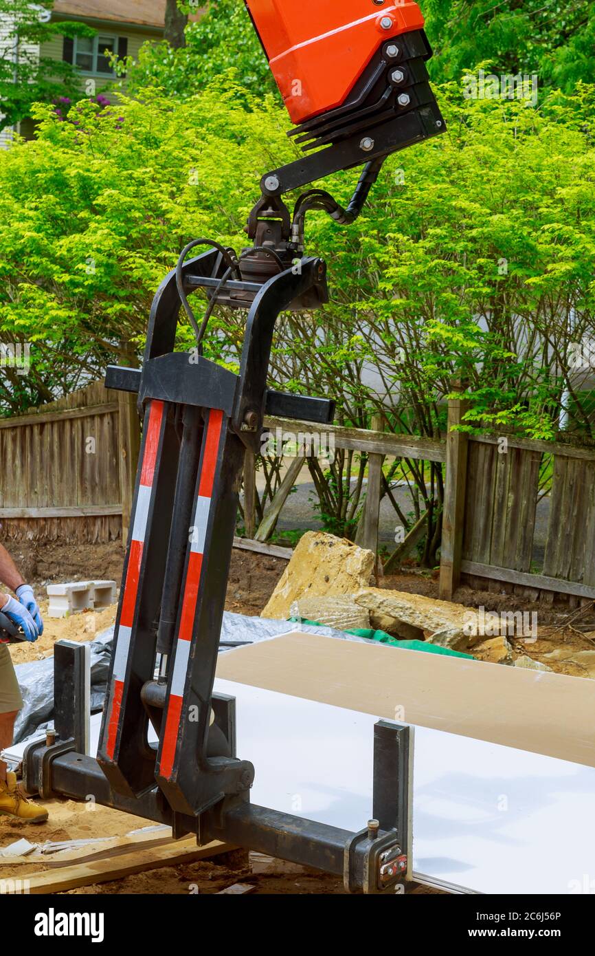 Worker at construction boom lift or telescopic boom lifts loader in a ...