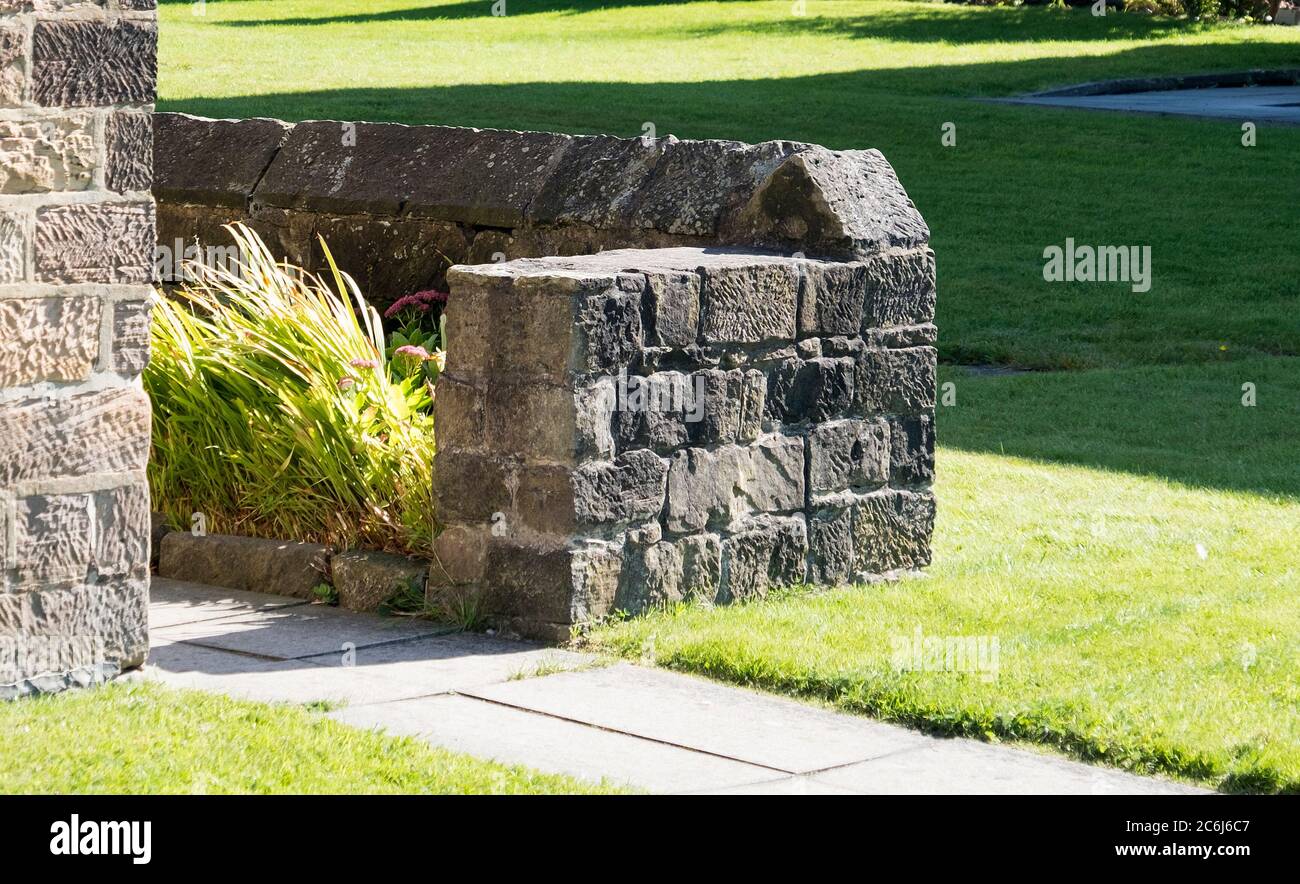 Thick low stone wall Stock Photo - Alamy