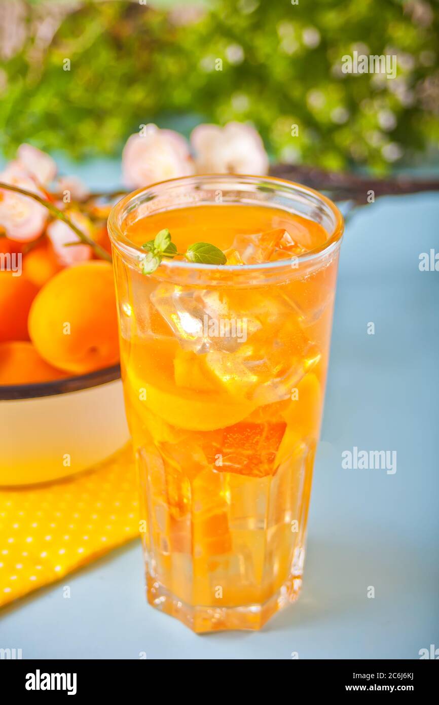 Summer cold drinks homemade apricot lemonade ice tea with ice cubes and ...