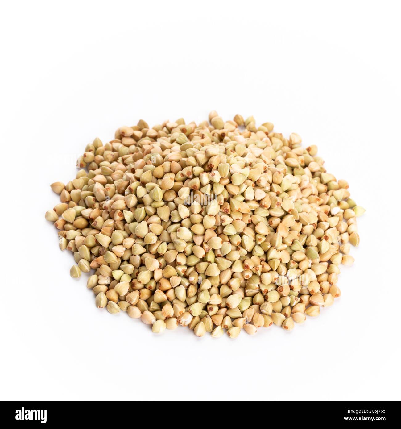 Heap of dried buckwheat seeds isolated on white background Stock Photo ...