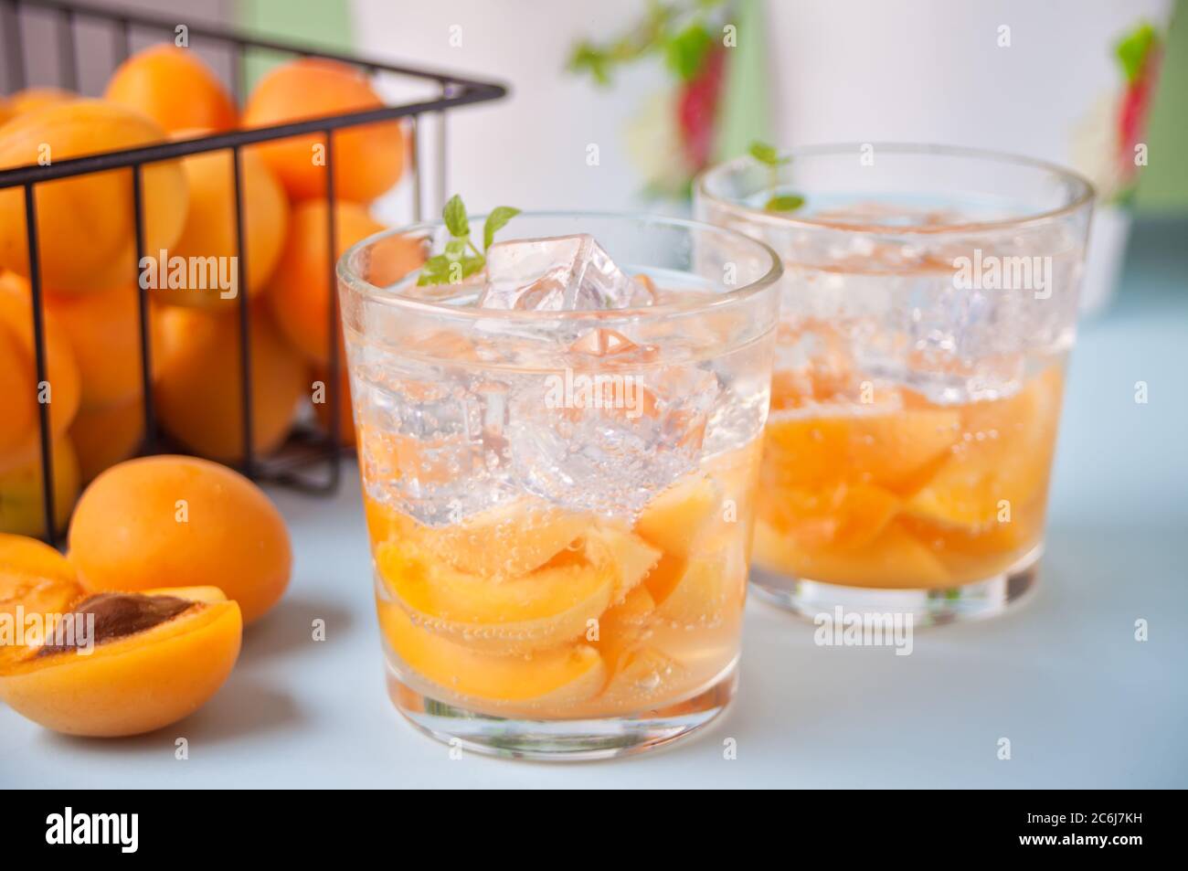 Summer cold drinks homemade apricot lemonade ice tea with ice cubes and ...