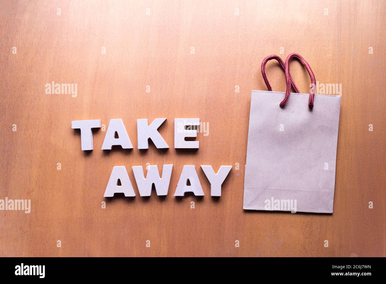 take away service concept ,take away text and Paper bag on wooden ...