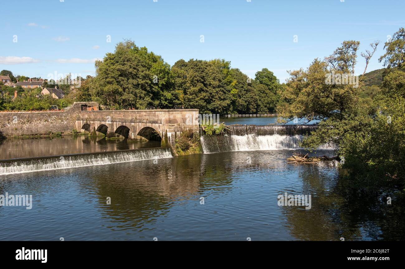 Old stone arched river weir bridge Stock Photo - Alamy